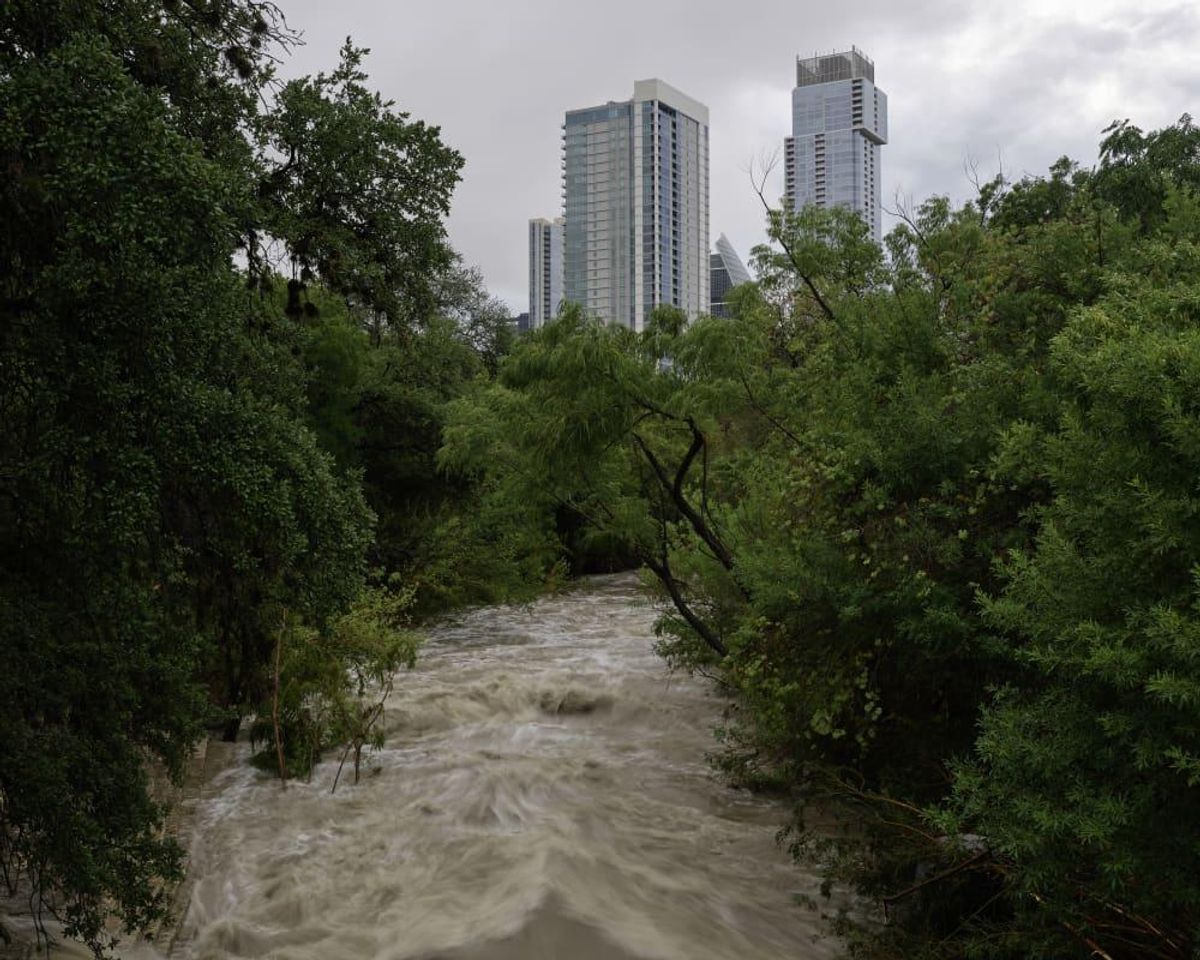 Flood waters flow toward Austin's tallest tower, the Independent ...