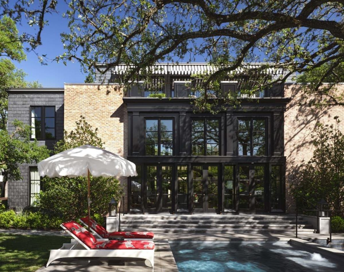 In addition to a pool, the home features a bocce court and putting ...