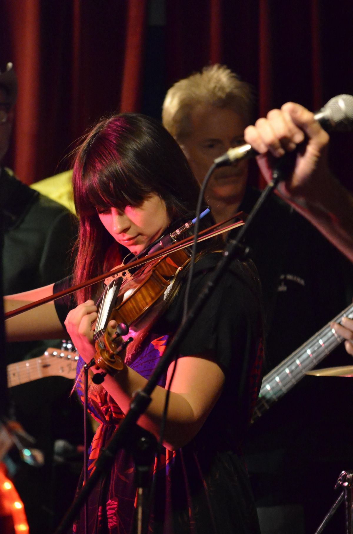 Ruby Jane's fingers race across her fiddle as she demonstrates her ...