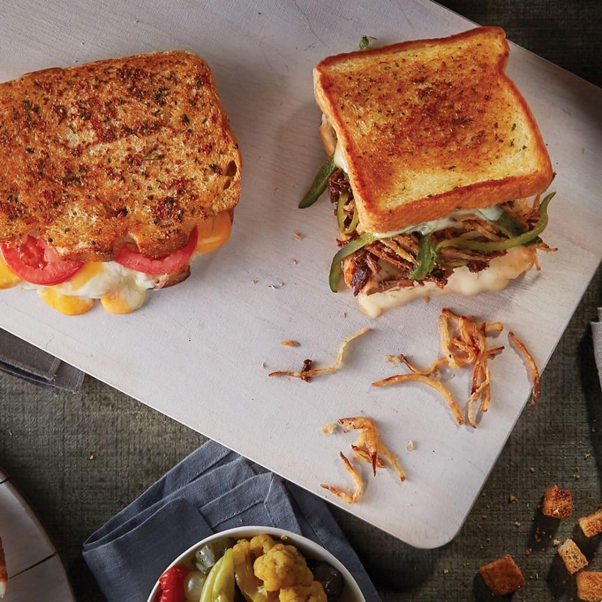 The Meltery, a grilled cheese shop, will join Roots Chicken Shak in the ...